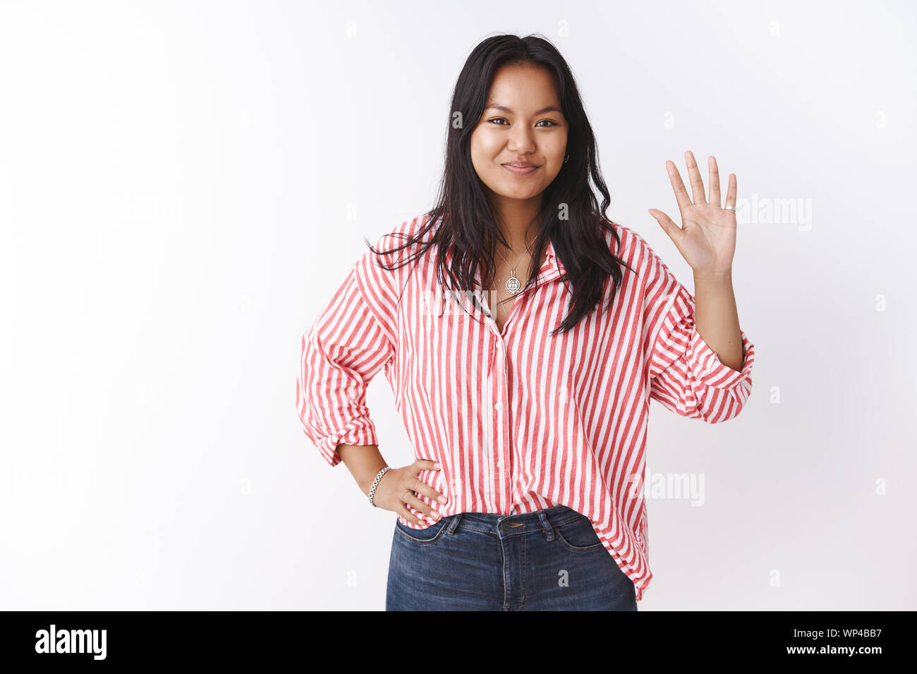 Studio shot of friendly and outgoing attractive new female coworker ...