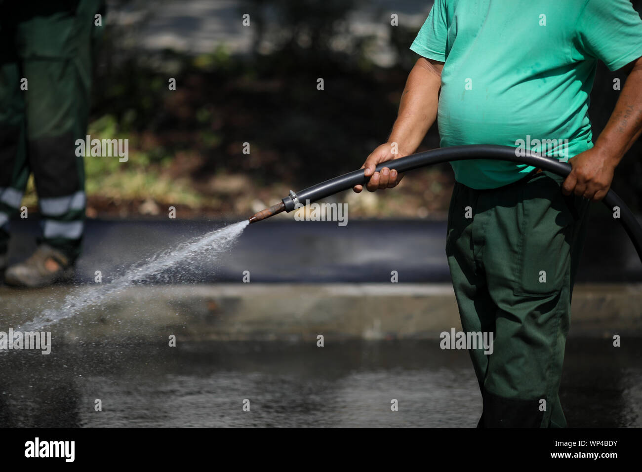 Broom on pavement hi-res stock photography and images - Alamy