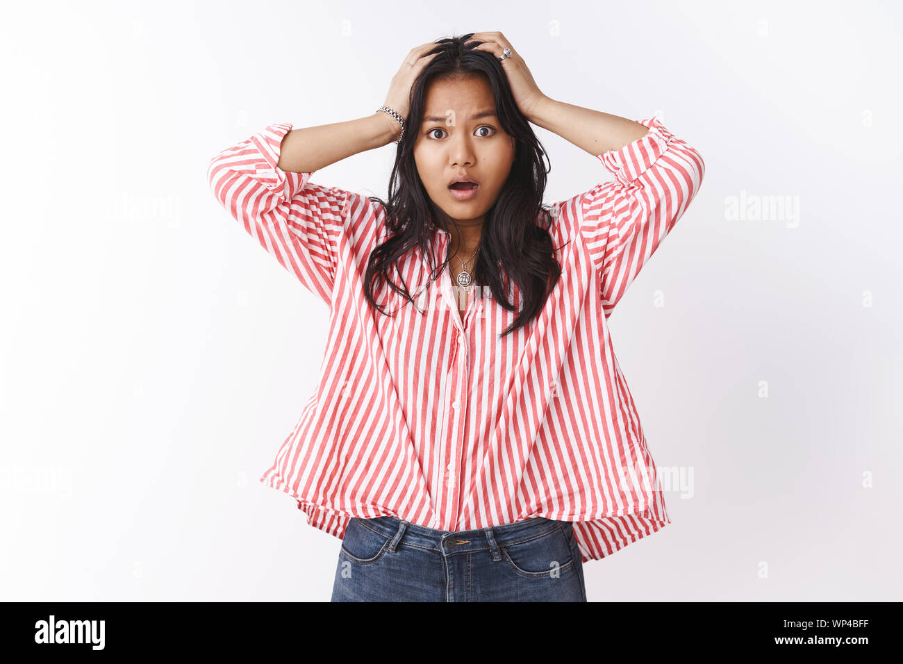 Perplexed and troubled young woman feeling confused and anxious facing ...