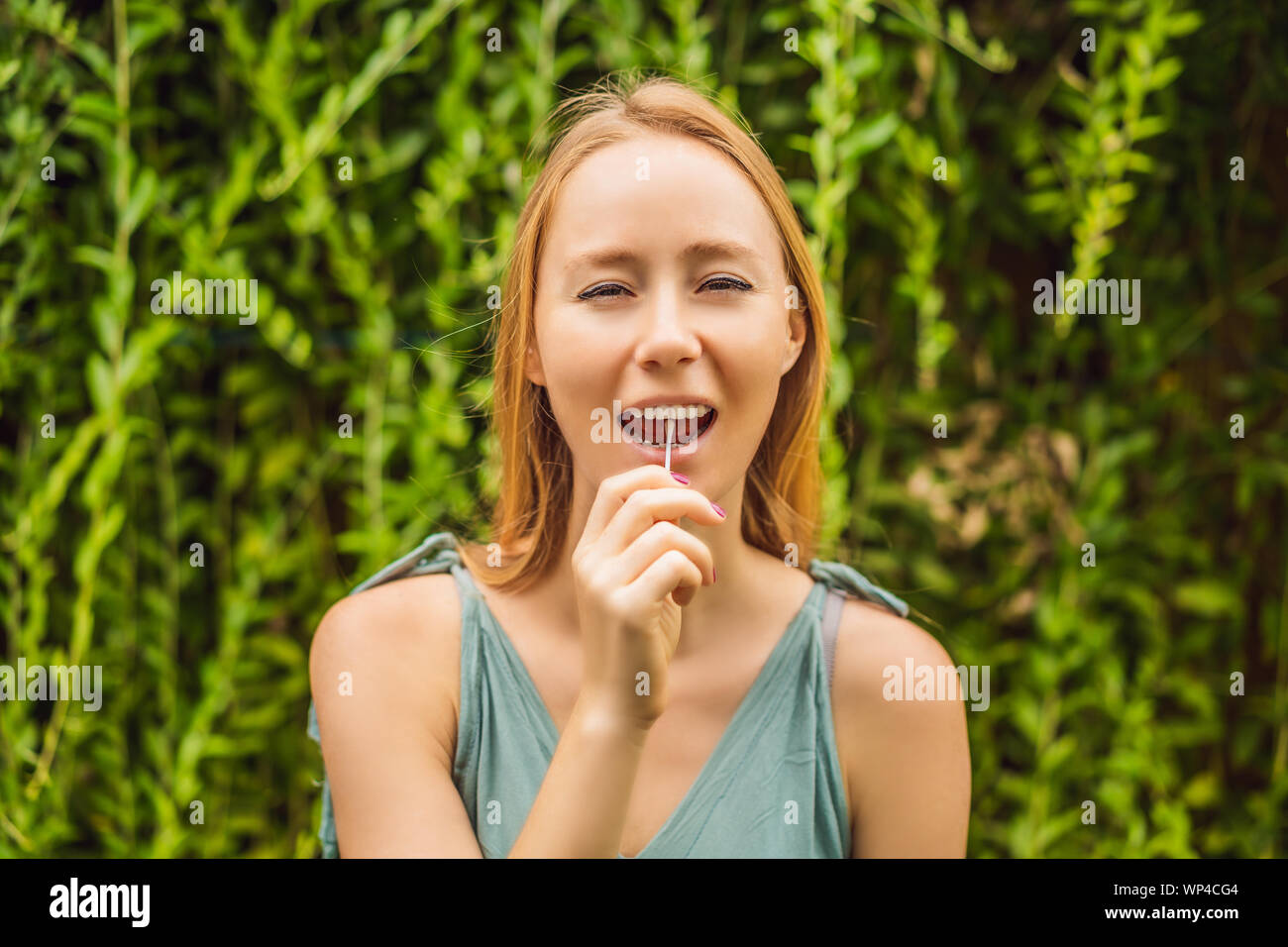 Woman doing DNA test with cotton swab. Test for home use Stock Photo ...