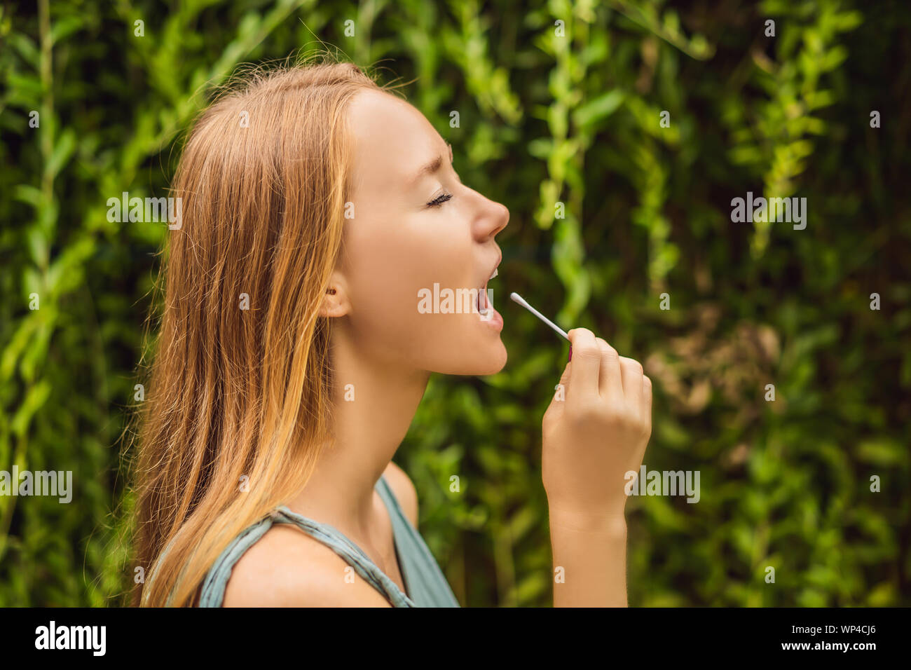 Woman doing DNA test with cotton swab. Test for home use Stock Photo ...