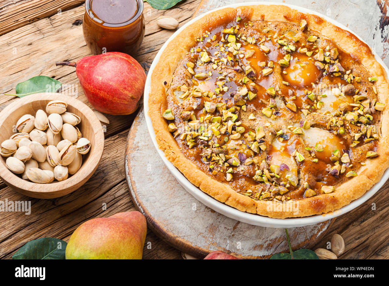 Autumn pie with pear and pistachio.Traditional autumn pie Stock Photo ...