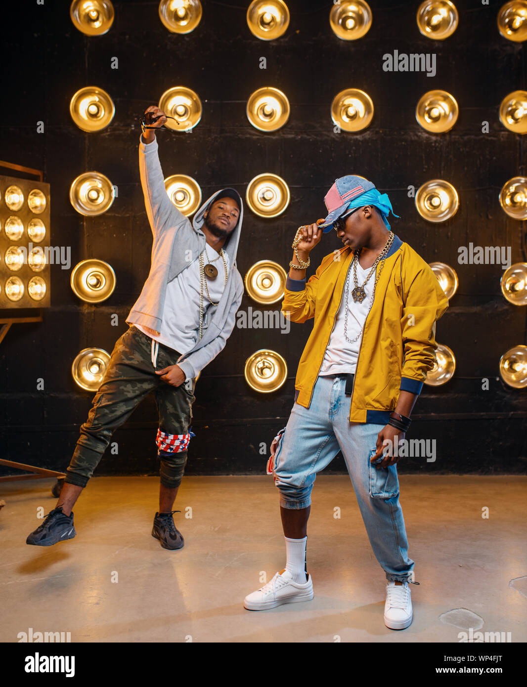 Two black rappers in caps, dance perfomance Stock Photo - Alamy