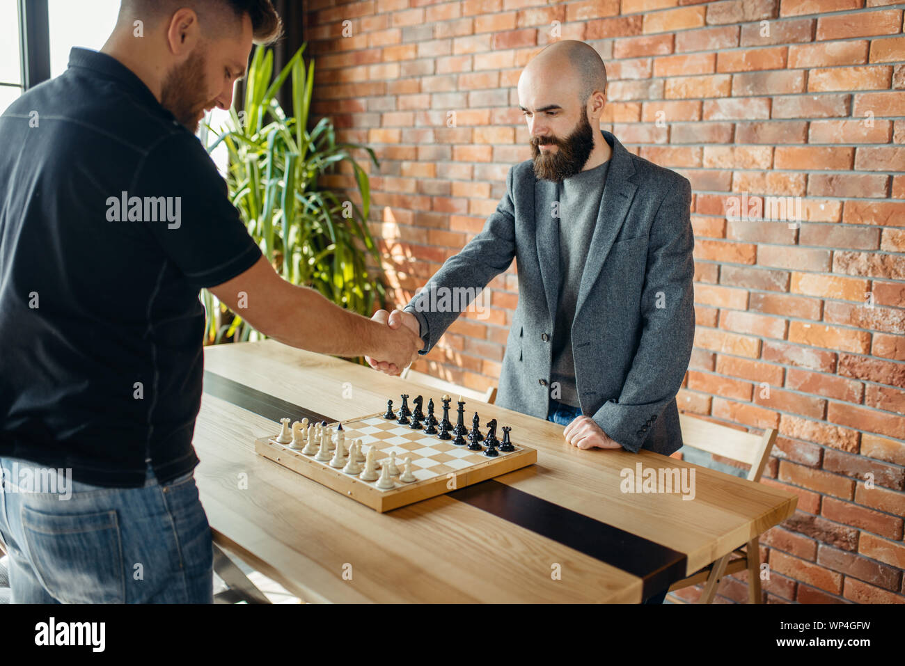 Chess players shake hands before the game Stock Photo - Alamy