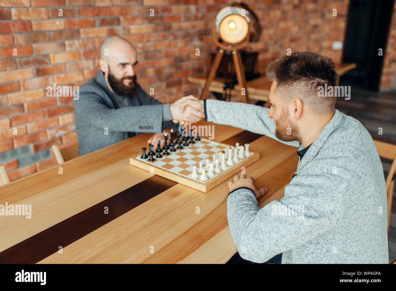 Chess players shake hands before the game Stock Photo - Alamy