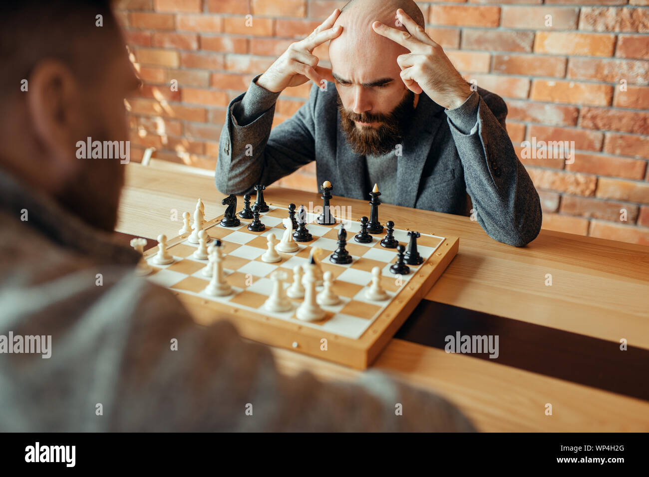 Male chess players playing, thinking process Stock Photo - Alamy