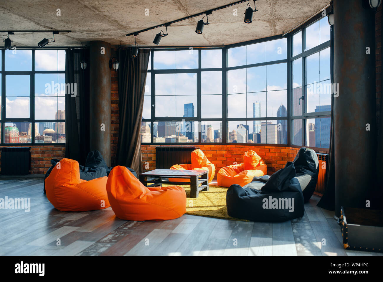 Apartment studio with panoramic cityscape view Stock Photo - Alamy