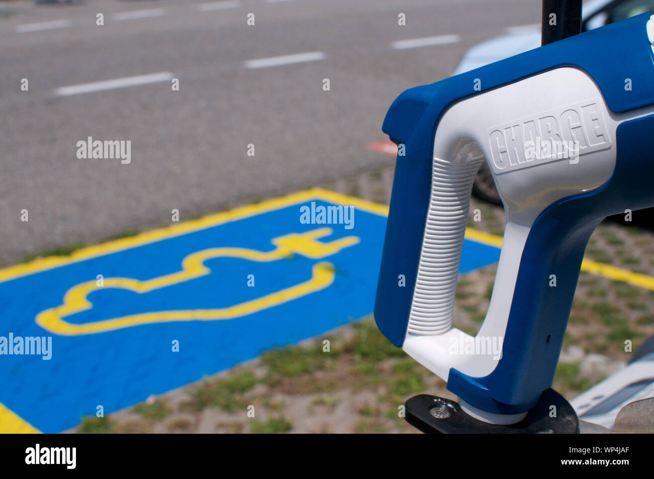 Close up picture of an electric charger connector for vehicles with a ...