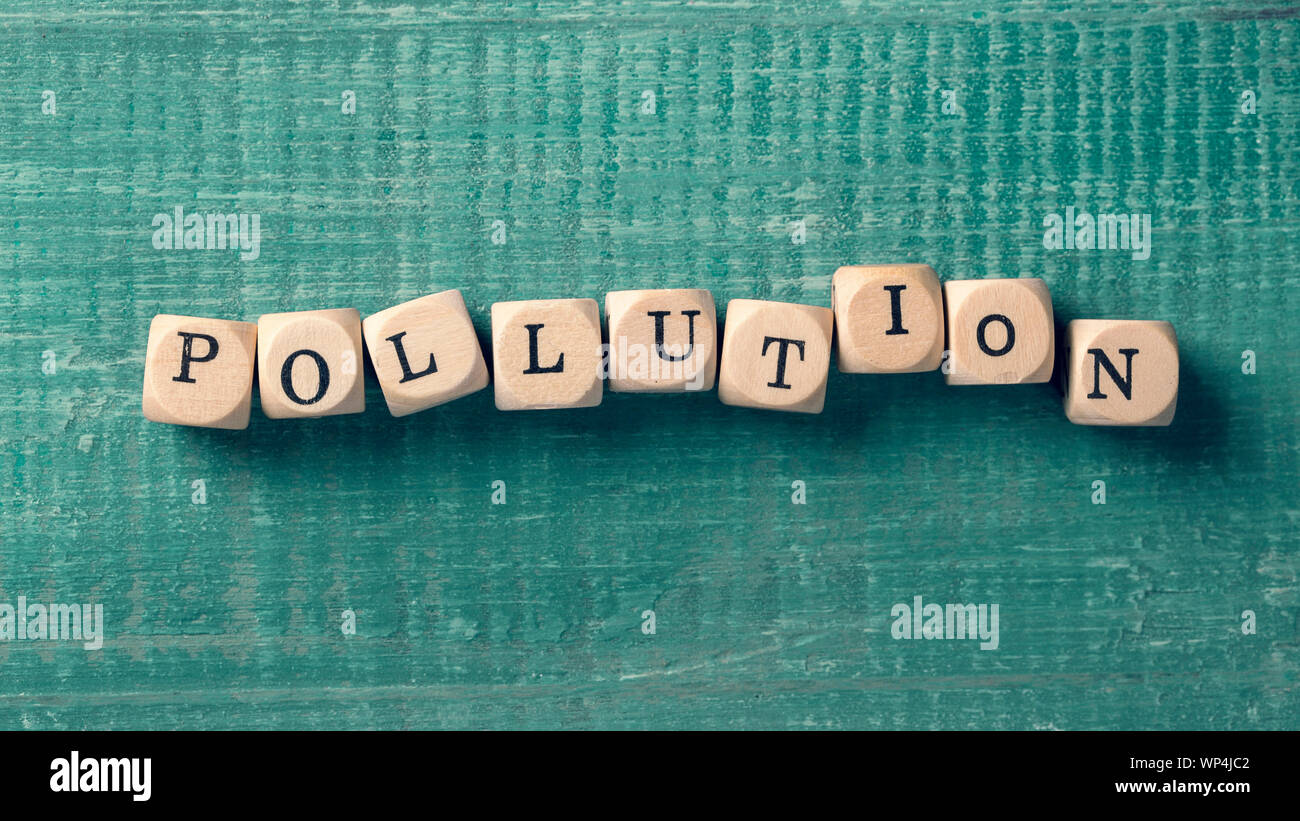 Letter cubes with word pollution. Environment concept Stock Photo - Alamy