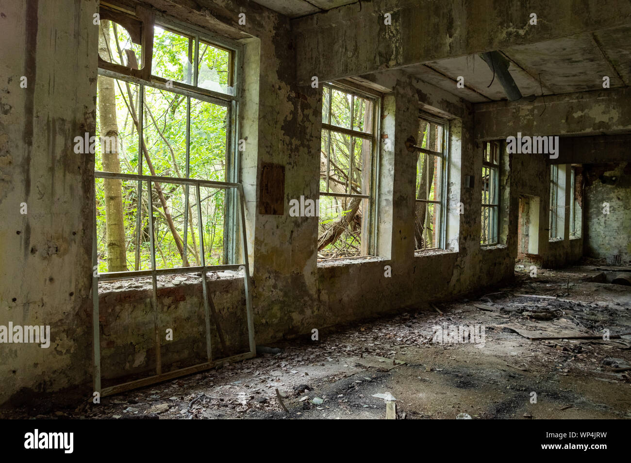 Broken windows in a large workshop. Large windows in the room Stock ...
