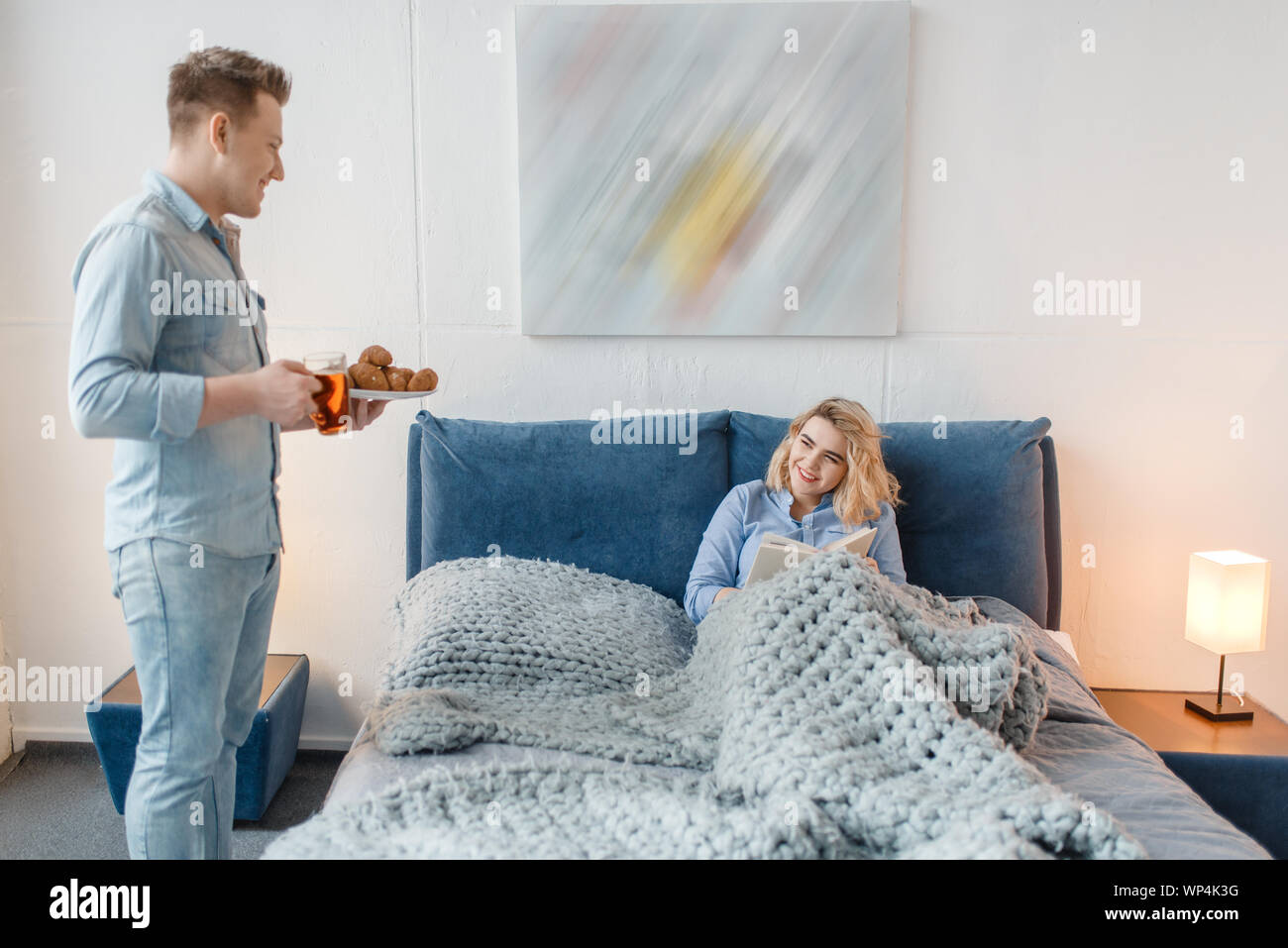 Love couple having romantic breakfast in bed Stock Photo - Alamy