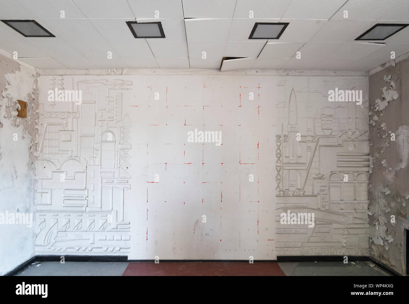Communist wall art depicting weapon industry at former historical ...