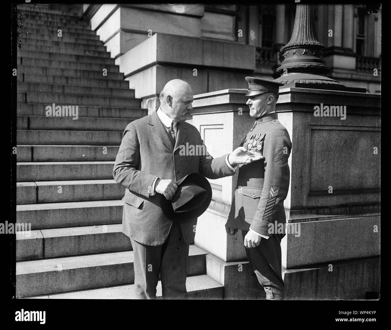 John W. Weeks on steps of State, War, and Navy Building, Washington, D ...
