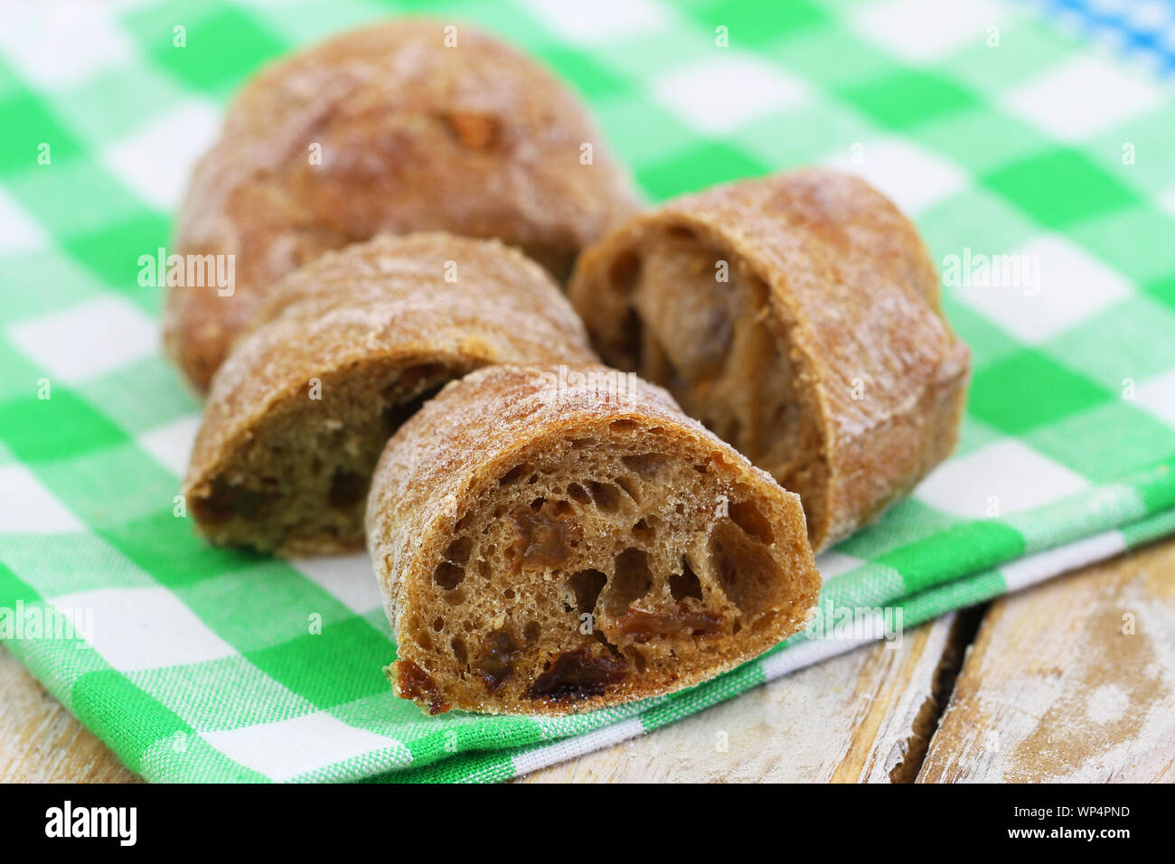 Close up of slices of brown bread with walnuts and raisins Stock Photo ...
