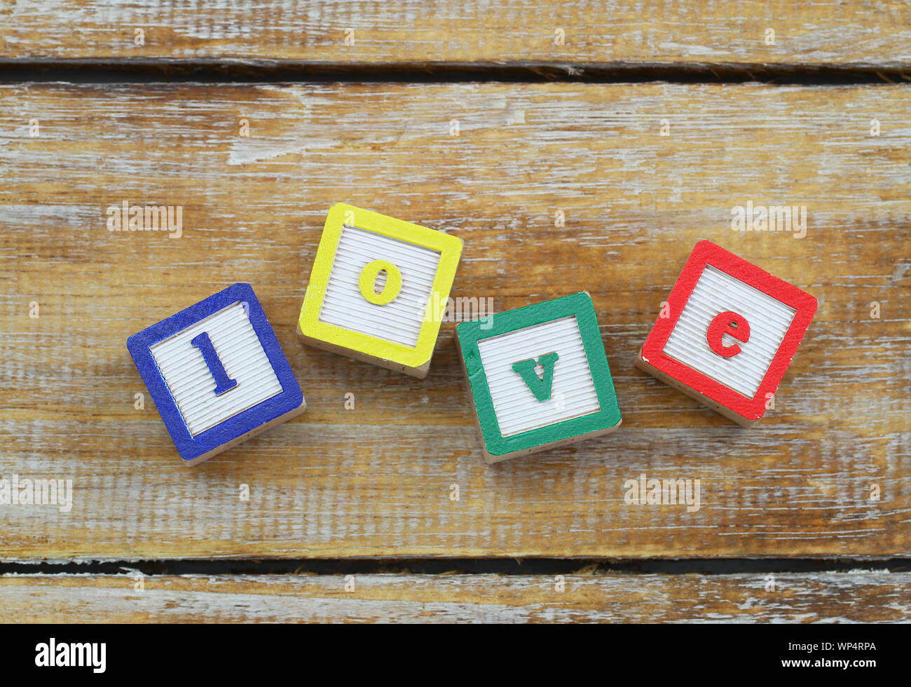 Wooden blocks with colorful letters love on rustic surface Stock Photo ...