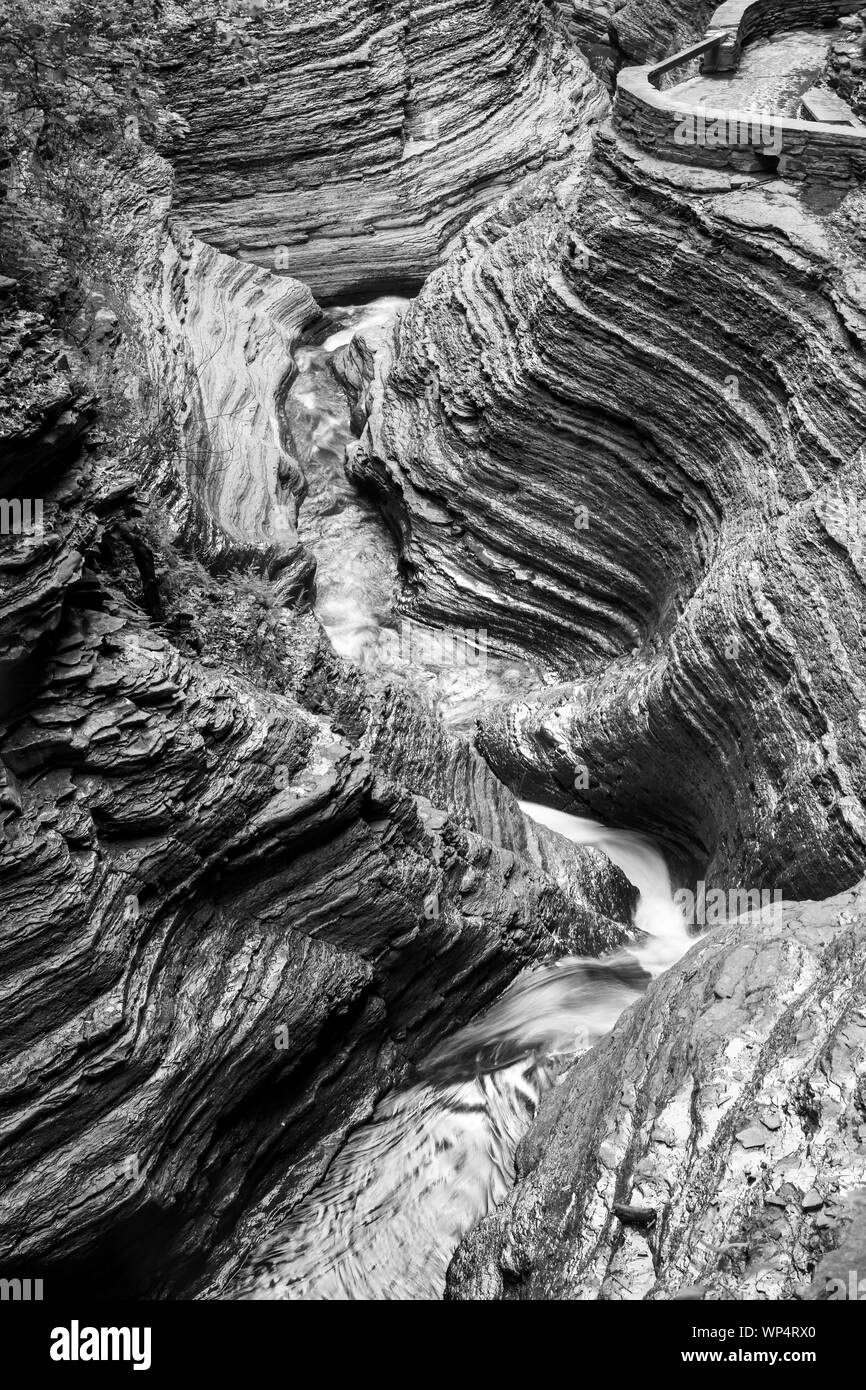 A black and white image shows ribbon like rock formations of the gorge ...