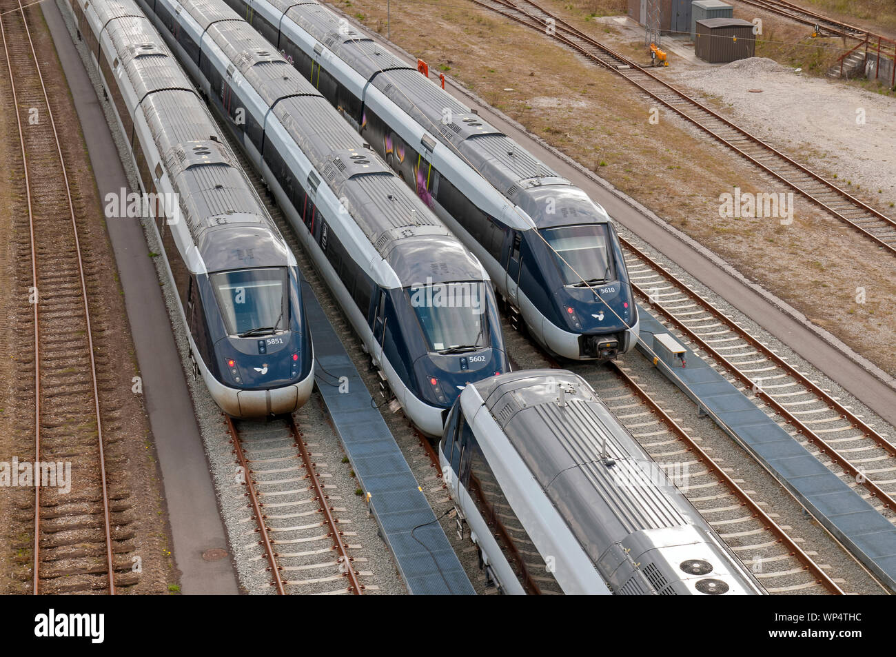 Trains on tracks Stock Photo - Alamy