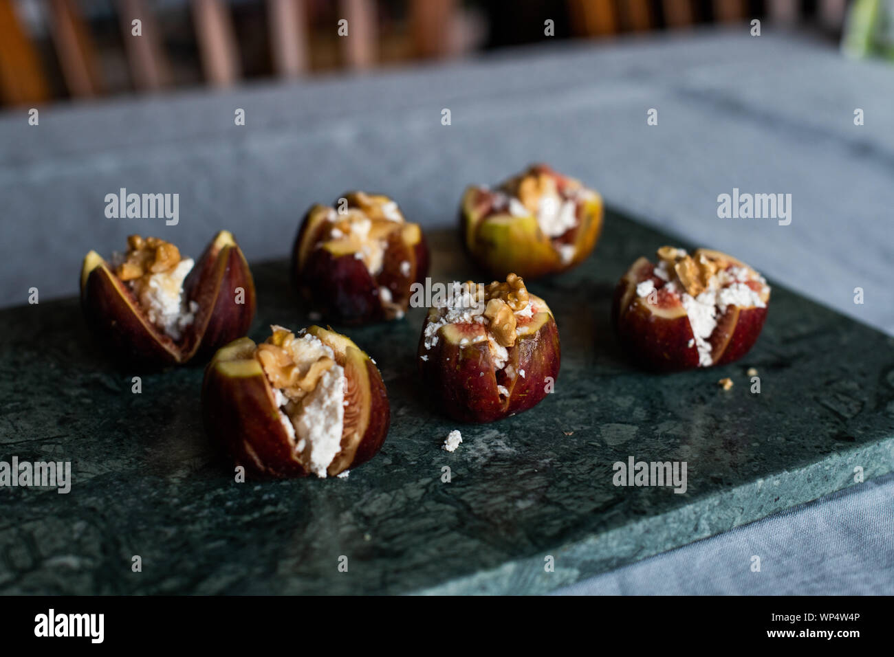 figs stuffed with ricotta cheese, walnut and honey served on green ...