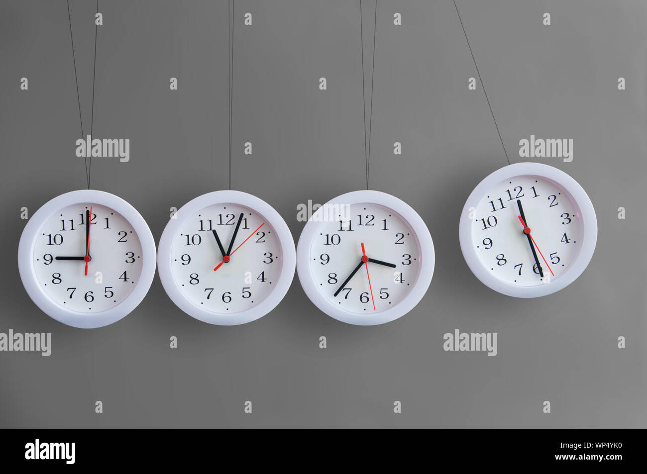 Clocks colliding into each other Stock Photo - Alamy