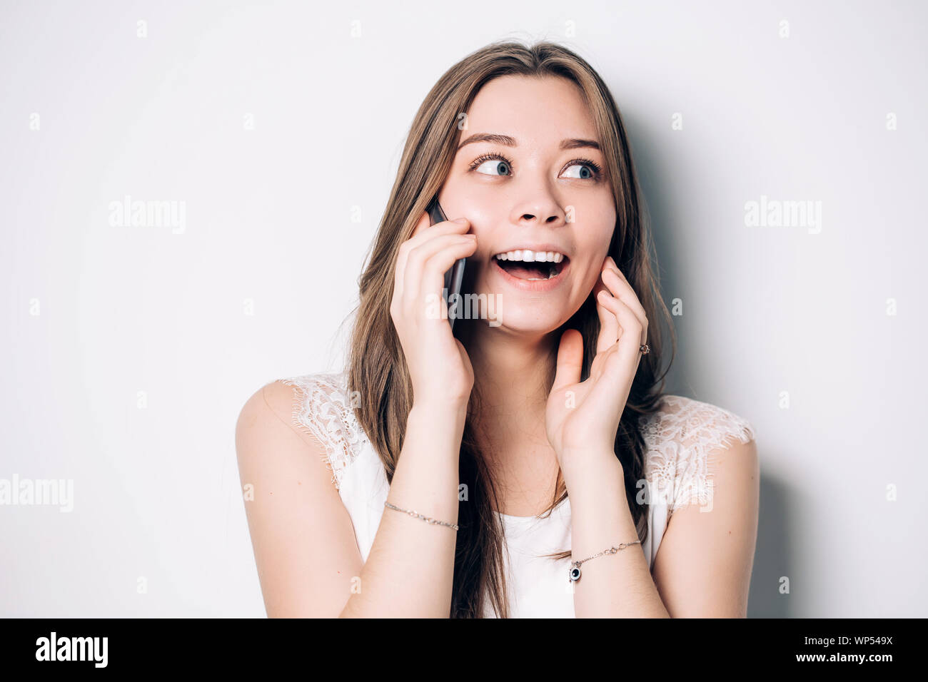 Happy woman phone talking. Face with toothy smile, isolated over white ...