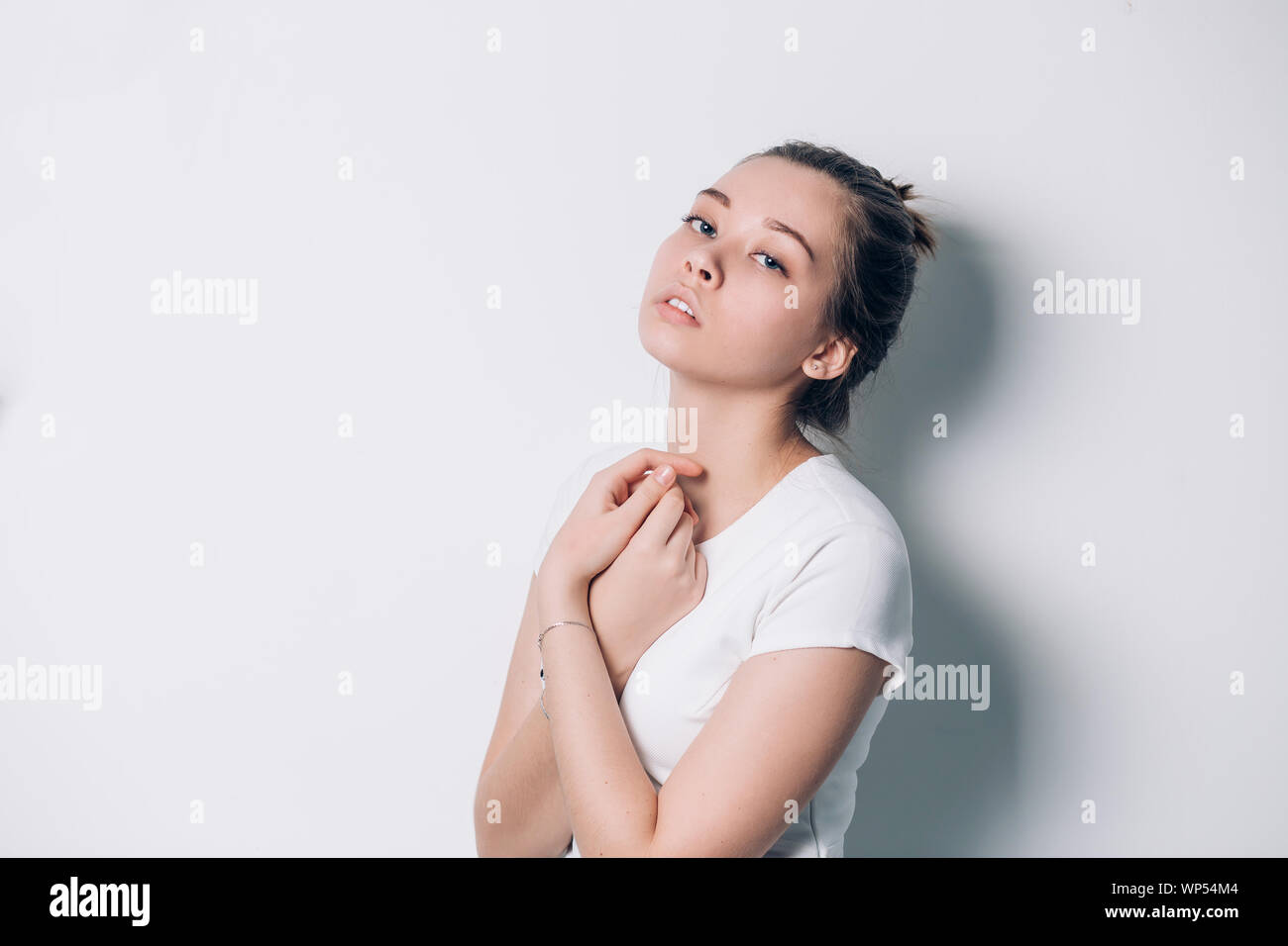 young beautiful sad woman serious and concerned looking worried and ...