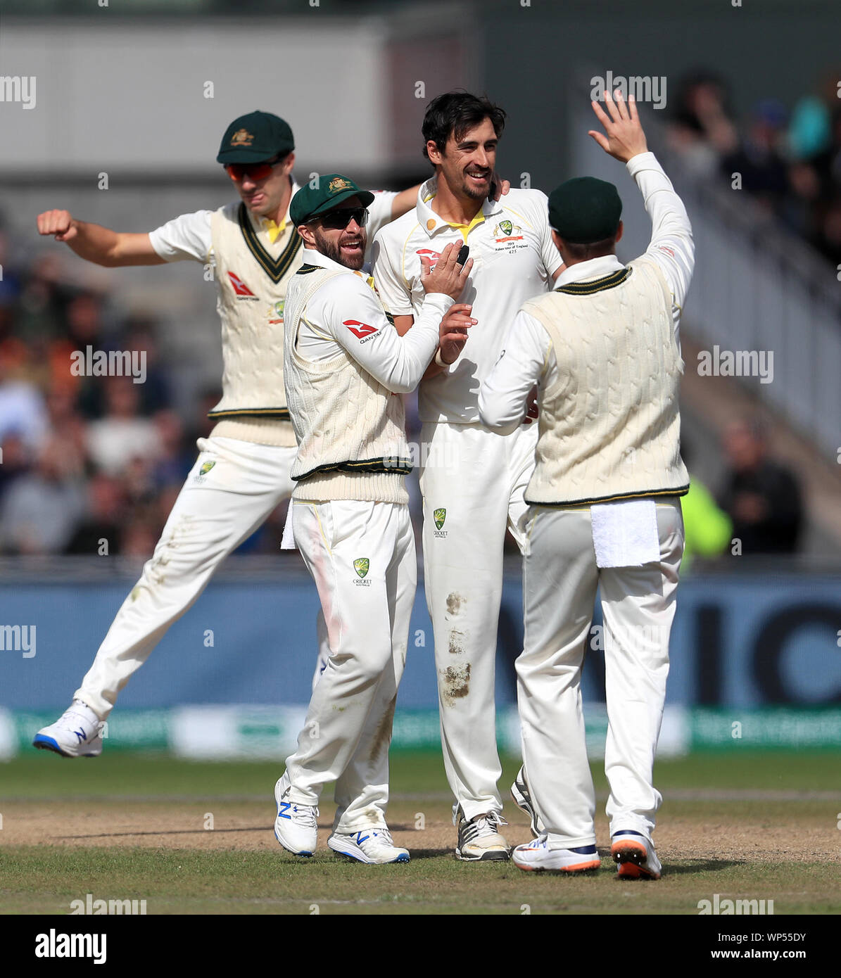 Australia's Mitchell Starc (centre) celebrates taking the wicket of ...