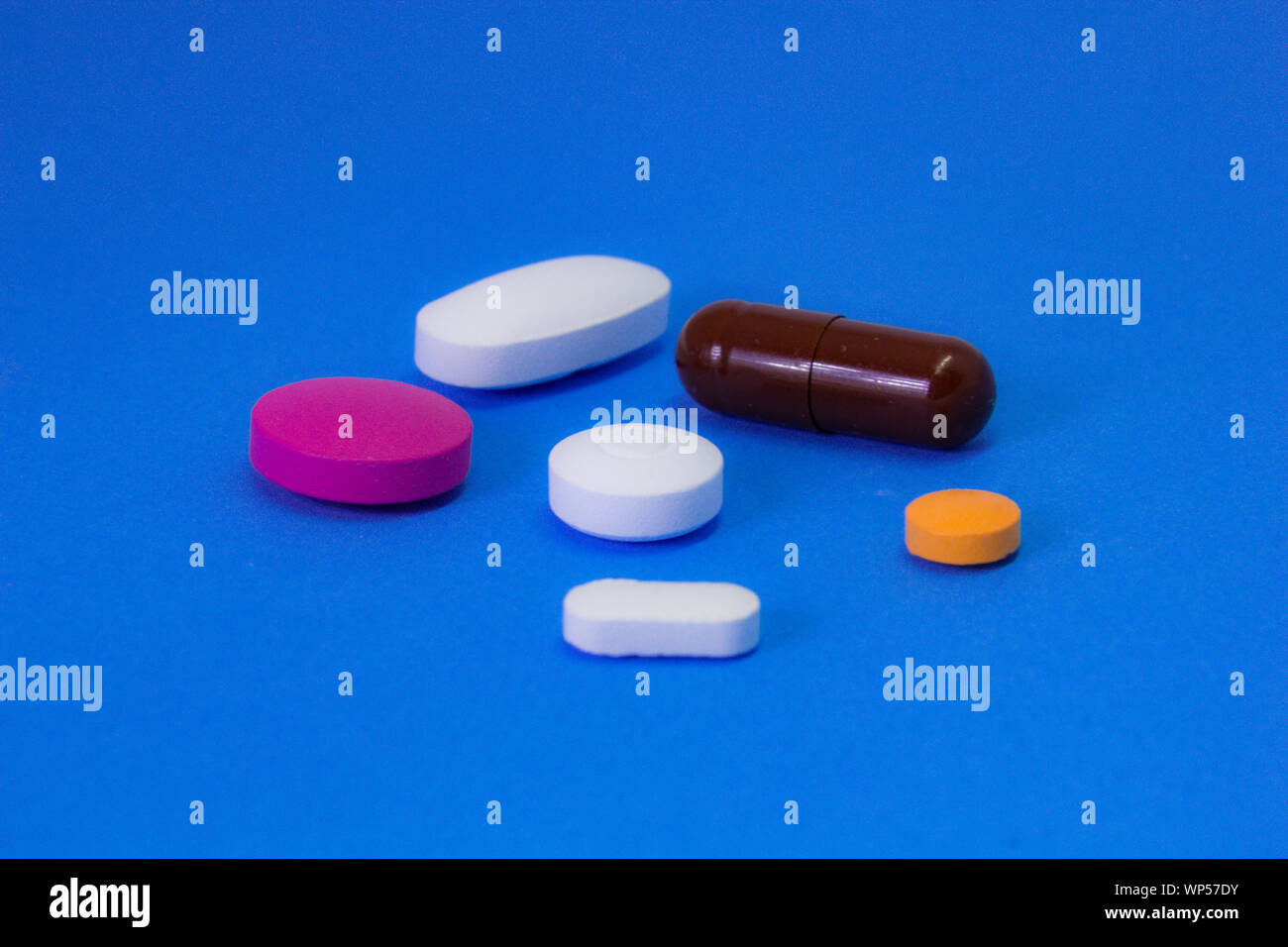 Pharmacy and Hospital theme. mix of pills and capsules with ...