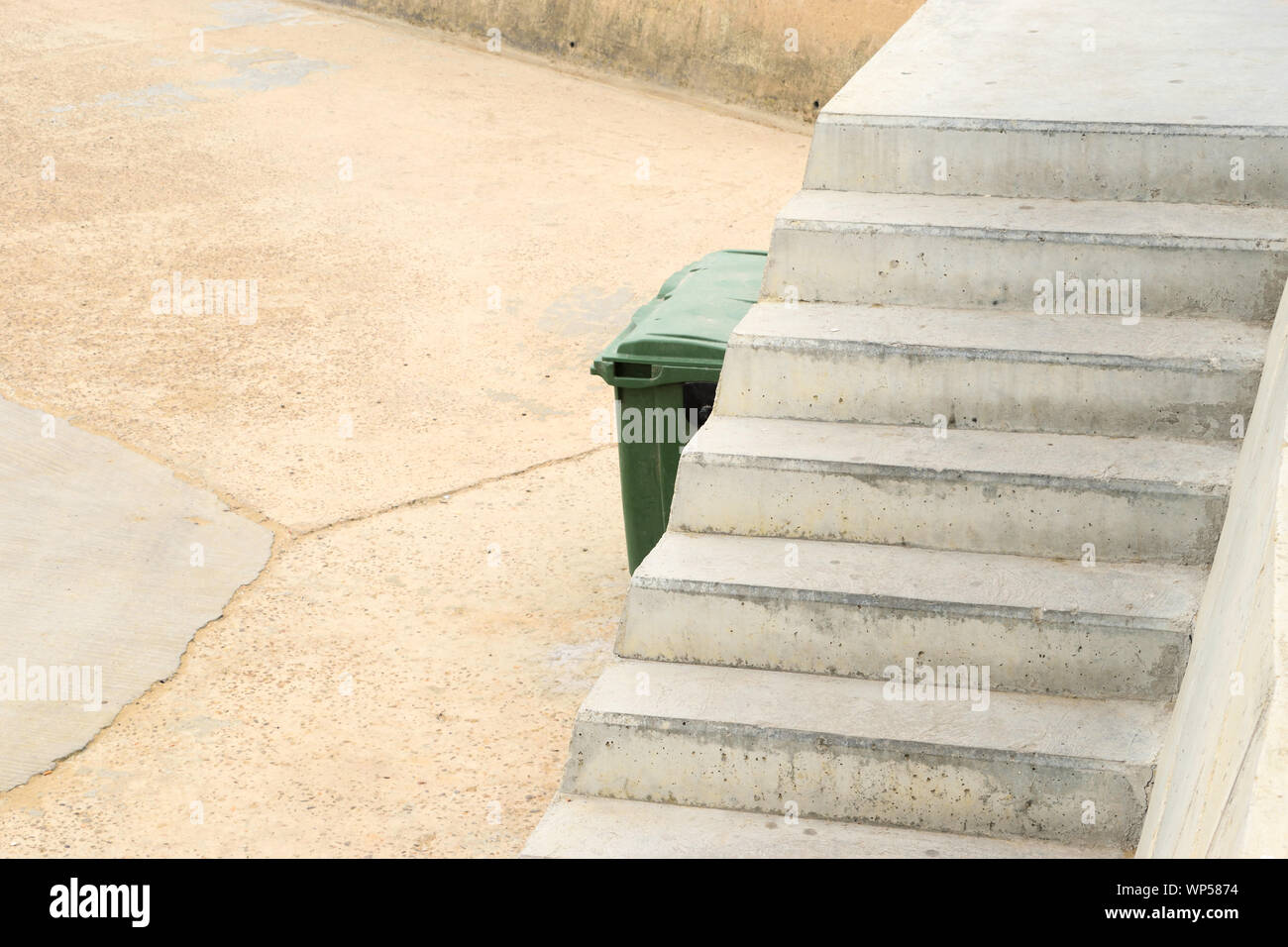 stair made by the concrete from top construction with container garbage ...