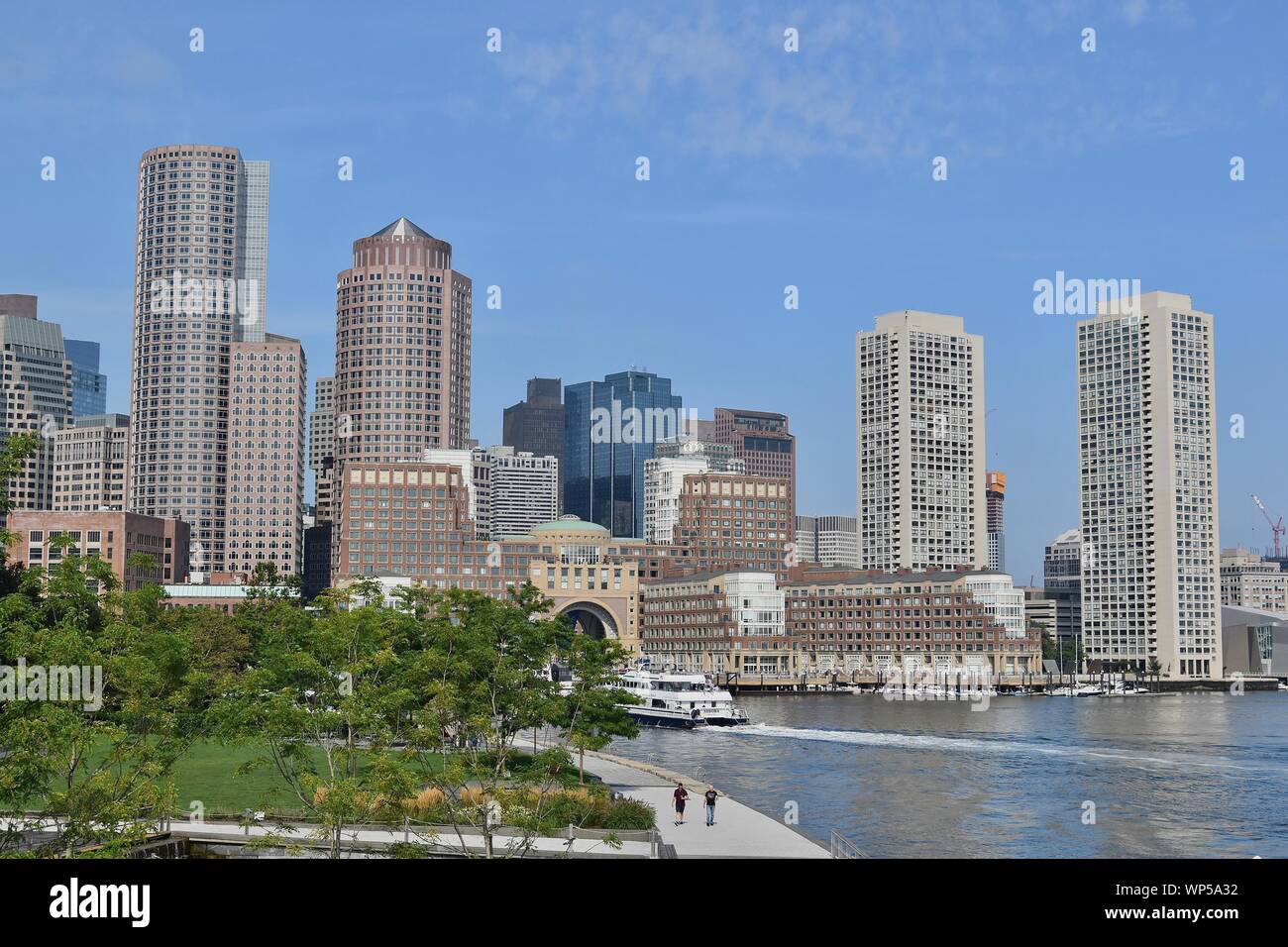 The downtown Boston skyline as seen from the Fan Pier Harbor Walk in ...