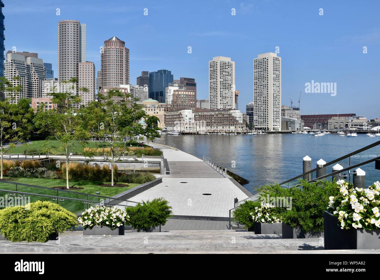 The downtown Boston skyline as seen from the Fan Pier Harbor Walk in ...