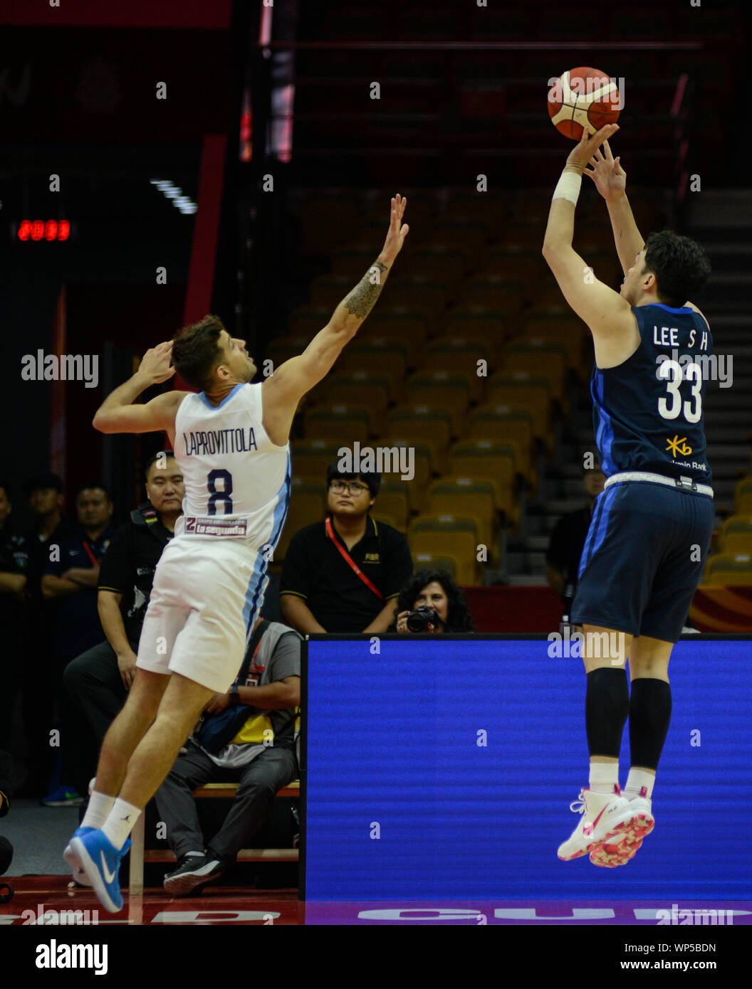Seounghyun Lee (South Korea) shooting over Nicolas Laprovittola ...