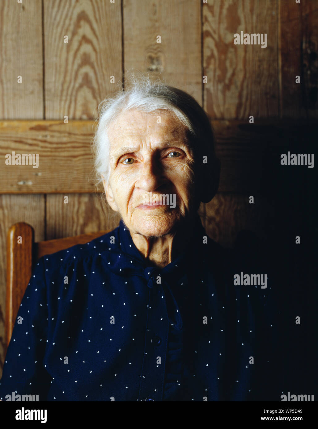 Kate Carter, on her 90th birthday, poses in the log cabins where ...