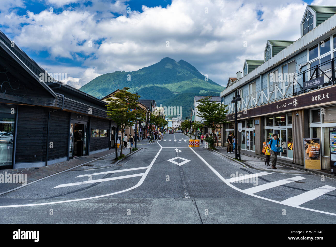 Yufuin, Japan - 12 July 2019 - Tourists walk along the main road from ...