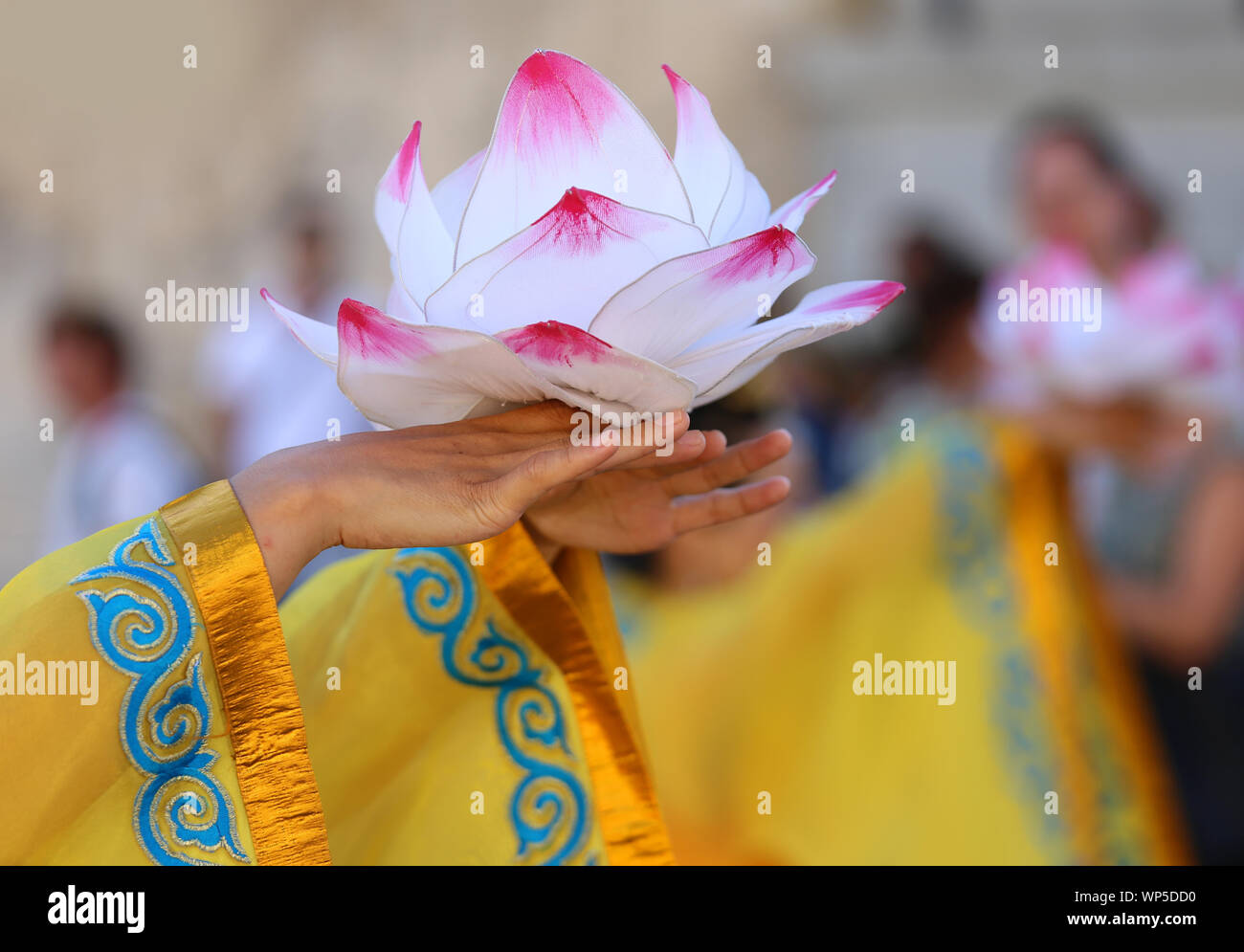 Big Lotus Flower on the hands of girl during an asian dance Stock Photo ...