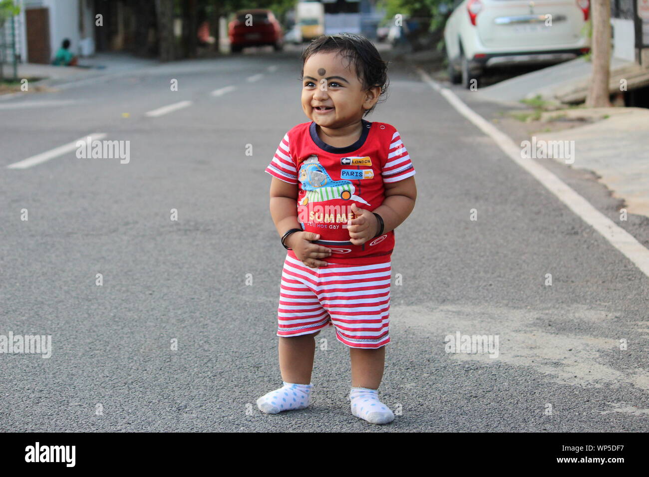 A Cute Baby on the road Stock Photo - Alamy