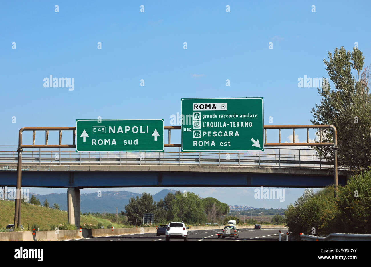 italian road sign on motorway near Rome City and the arrows directions ...