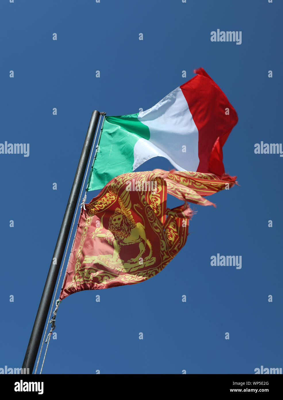 Italian flag and the Flag of Venetian al so called Bandiera del Veneto ...