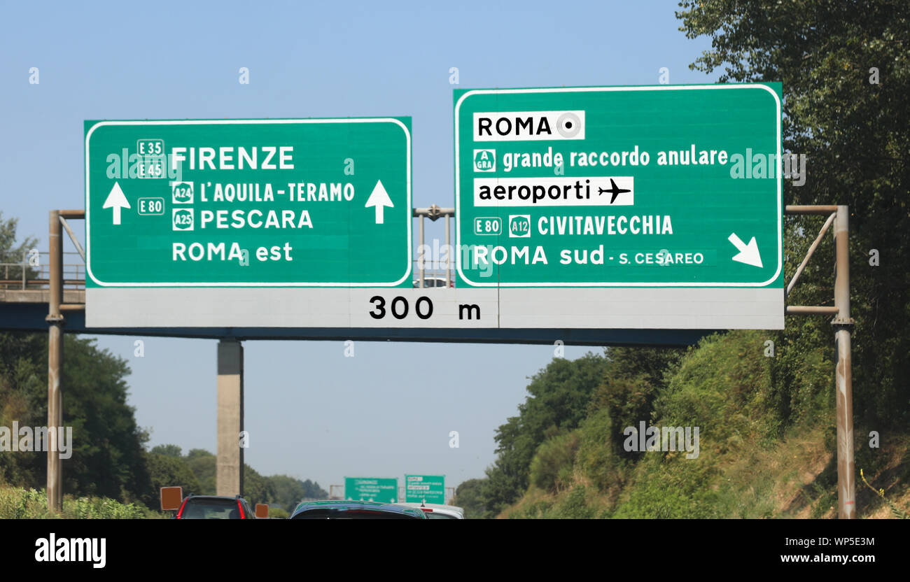 Road junction on italian highway with directions to Rome or Florence in ...