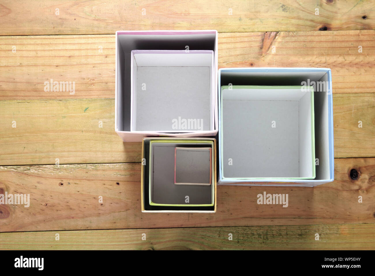 Cardboard Boxes on Wooden Background Stock Photo - Alamy