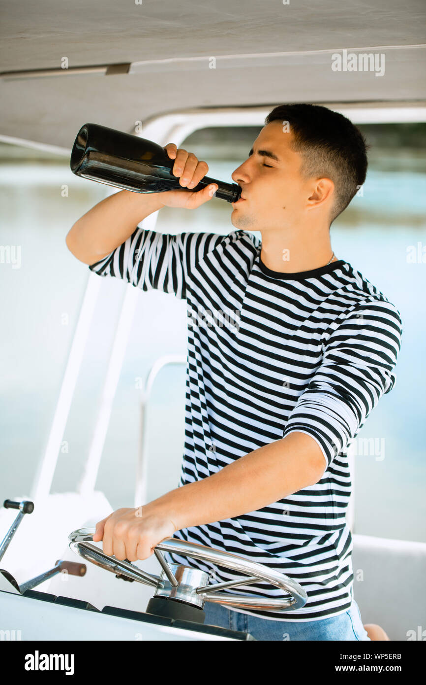 Man boat drink hi-res stock photography and images - Alamy