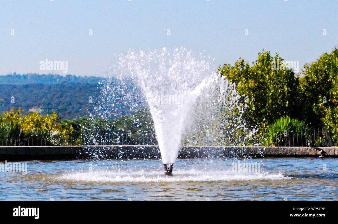 fountain pouring water in spring Stock Photo - Alamy
