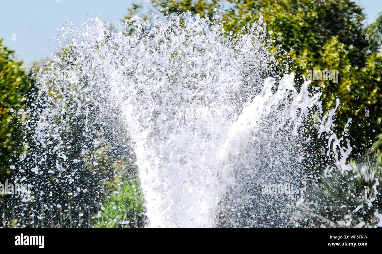 fountain pouring water in spring Stock Photo - Alamy