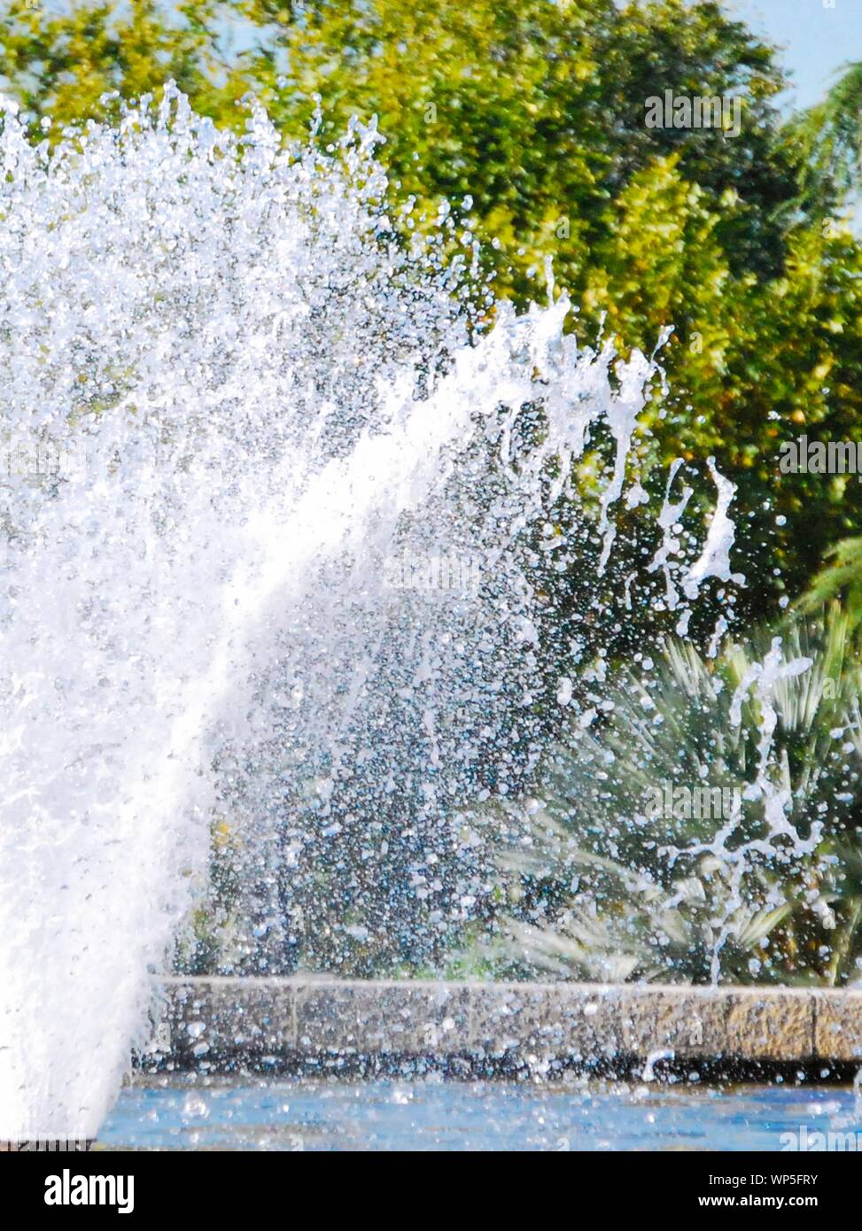 fountain pouring water in spring Stock Photo - Alamy