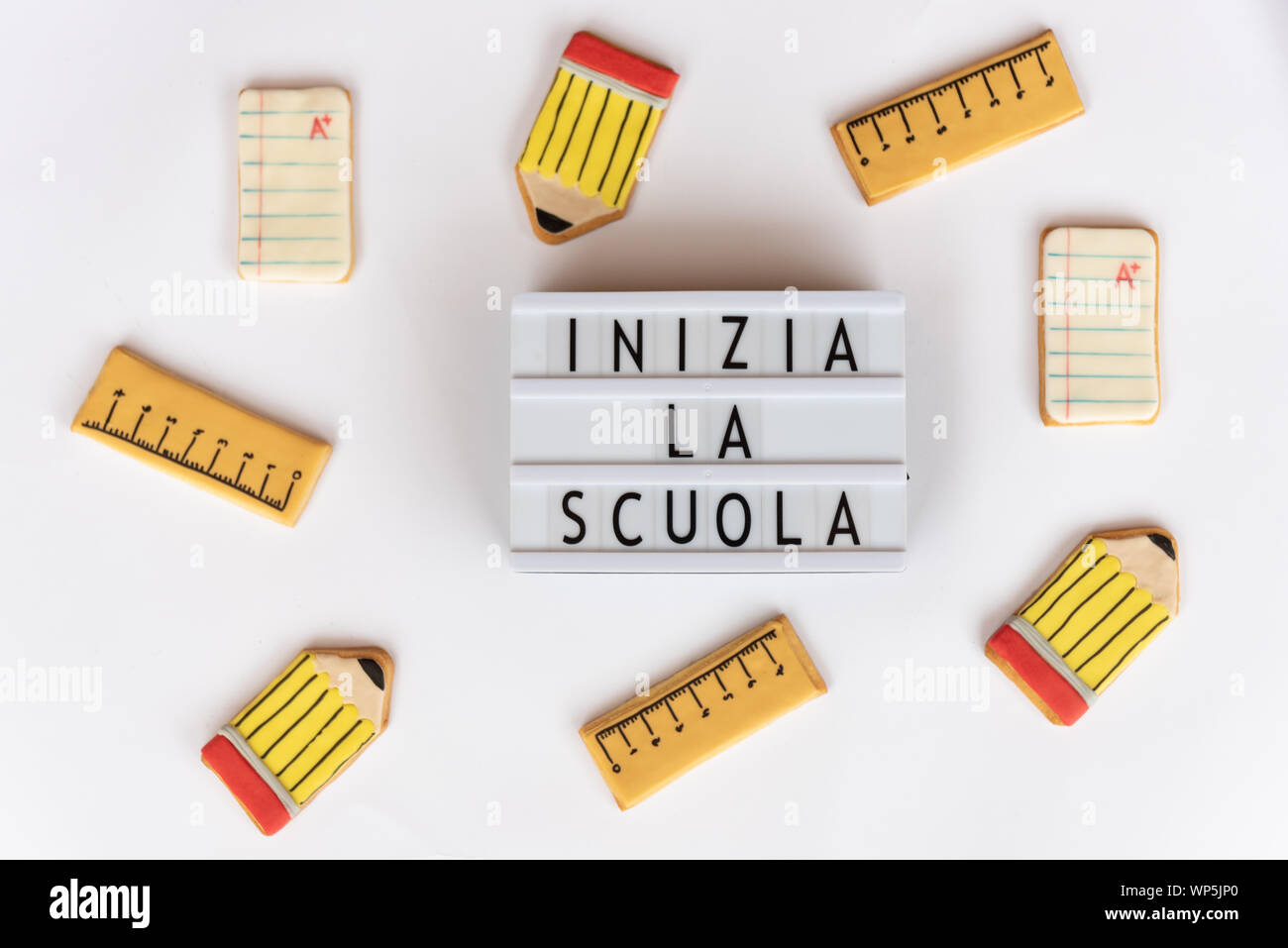 Back to school concept. The text inizia la scuola in a lightbox (back ...