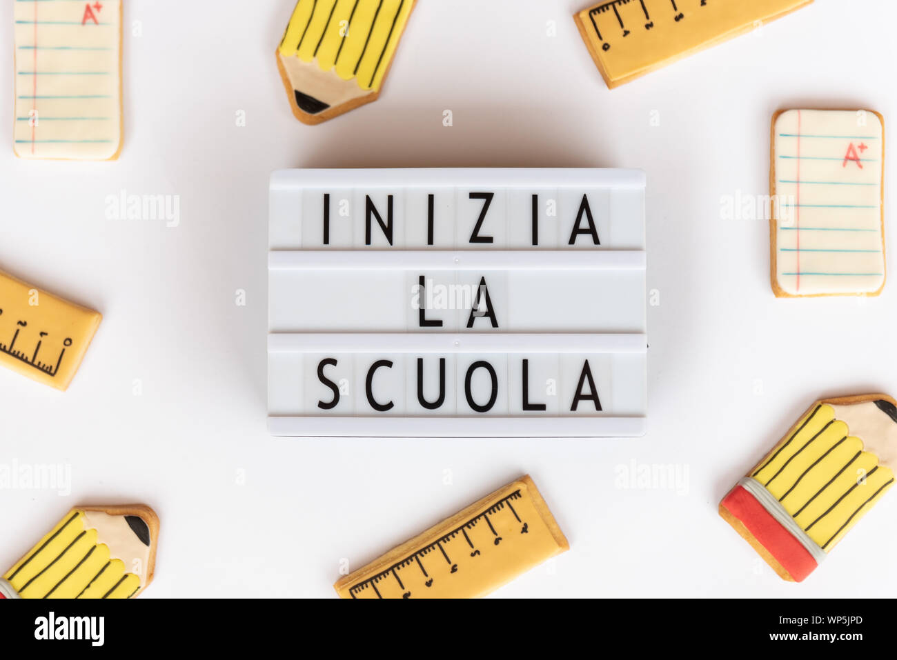 Back to school concept. The text inizia la scuola in a lightbox (back ...