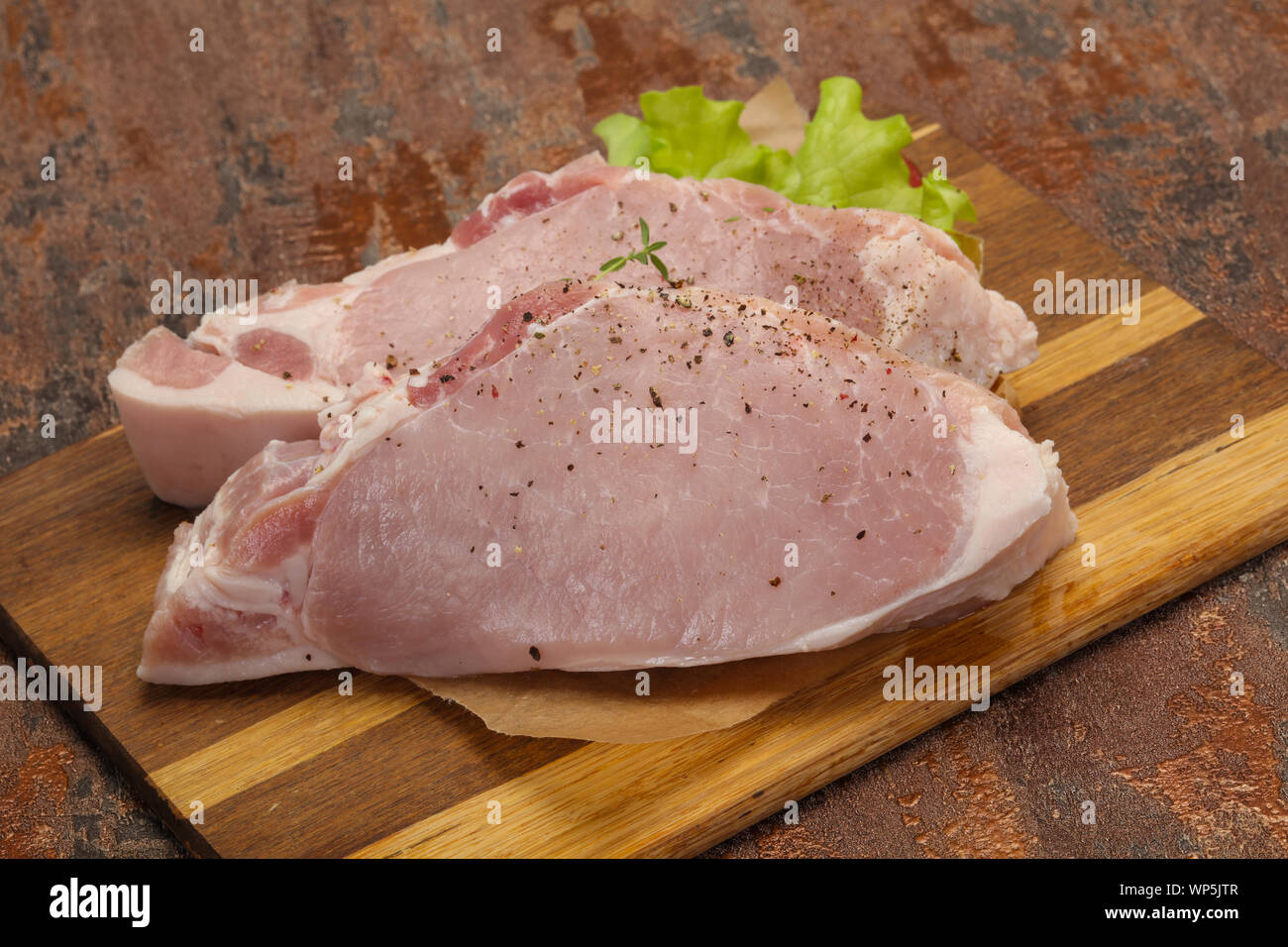 Raw pork meat steak ready for grill Stock Photo - Alamy