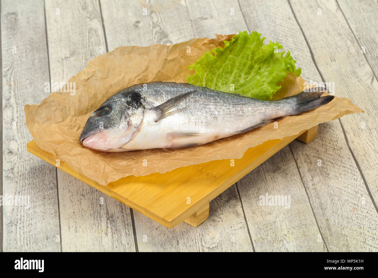 Raw Dorada fish ready for cooking Stock Photo - Alamy