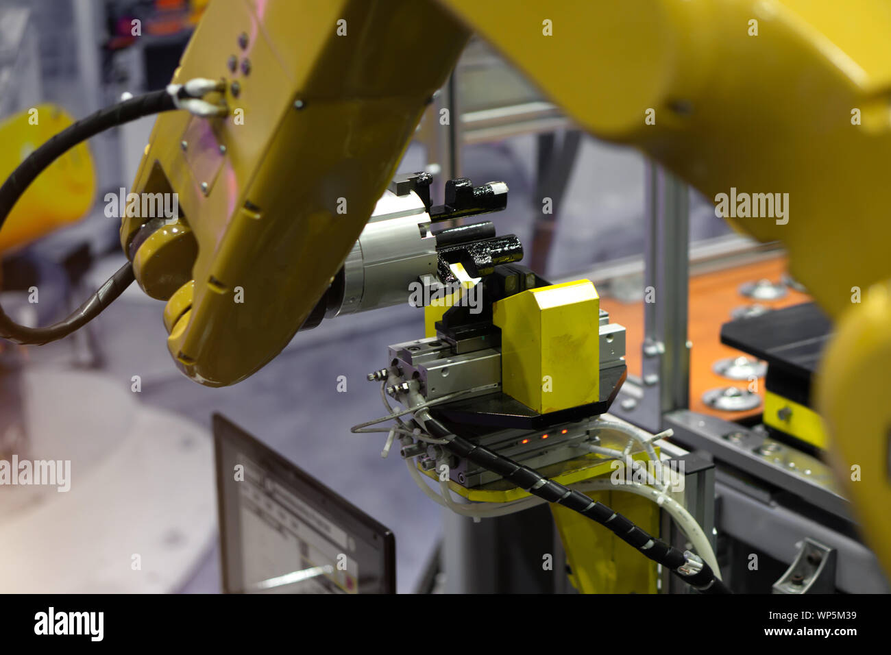 Robot hand machine in industrial that is working process Stock Photo ...