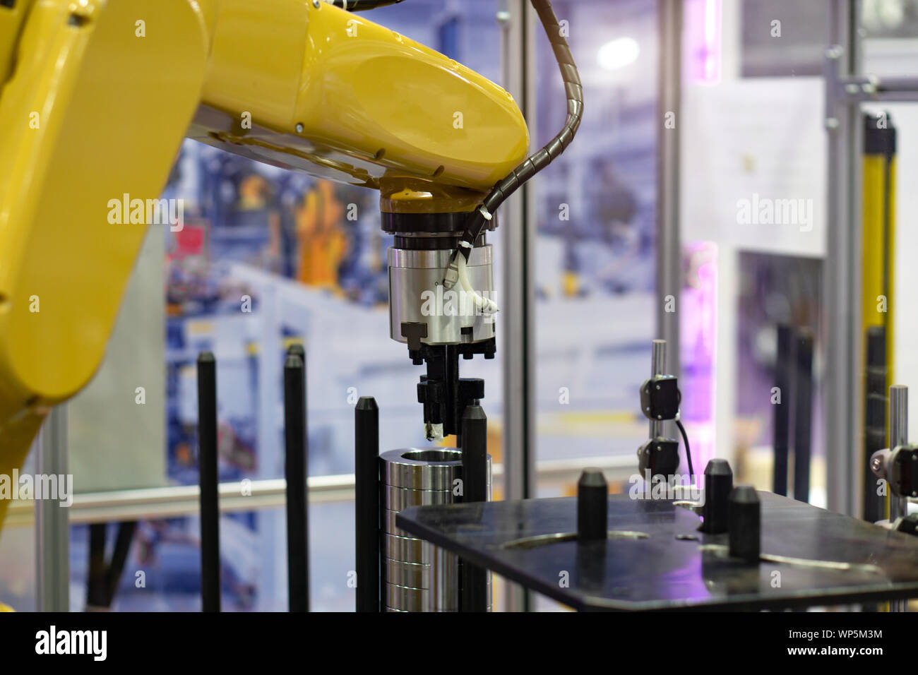Robot hand machine in industrial that is working process Stock Photo ...