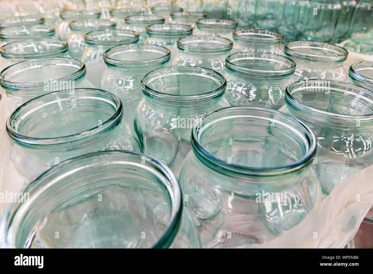 Lots of empty transparent jars in rows background Stock Photo - Alamy Lots of empty transparent jars in rows background Stock Photo - Alamy